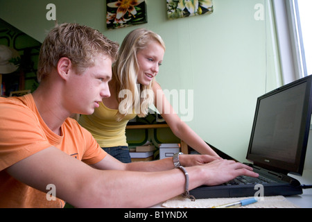 Teenage boy and girl behind computer Stock Photo - Alamy