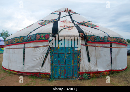 Traditional Mongolian portable round tent ger covered with white outer ...