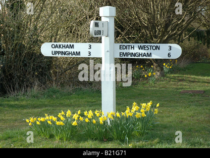 Village signpost distance miles spring blossom Hollesley, Suffolk Stock ...