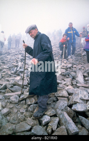 People climbing Croagh Patrick a holy mountain in County Mayo, Ireland ...