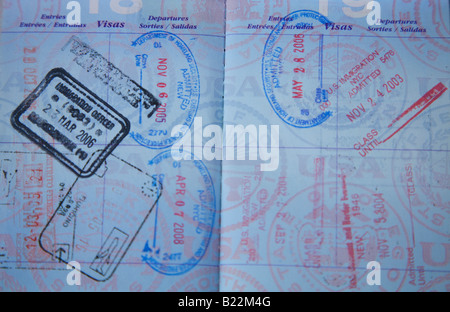 Travel passport with multiple visa stamps, entry and exit marks, border ...