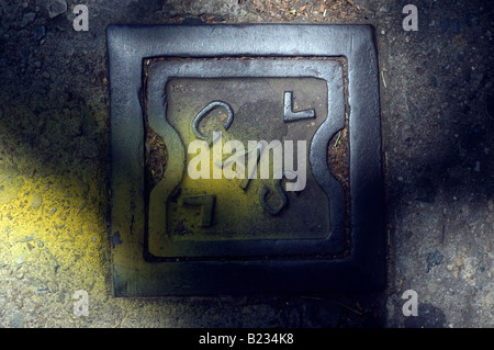 Close up of gas valve cover on street Stock Photo - Alamy