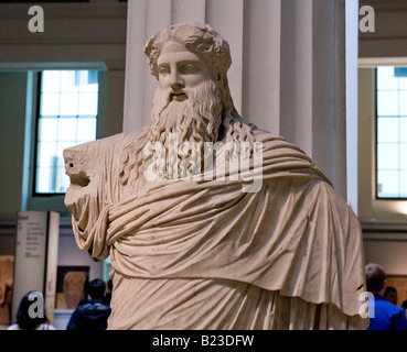 Marble Statue of the Greek God Dionysus by garden pond in Kent in ...