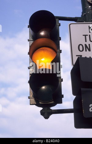 Yellow caution light in the street at night Stock Photo - Alamy