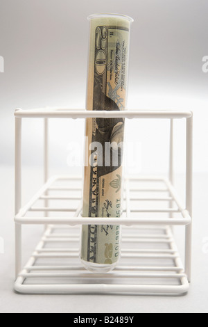 American banknote in a test tube Stock Photo - Alamy