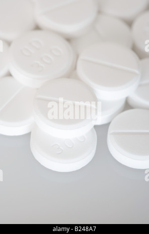 A close up of round white tablet effervescent tablet in a glass of ...