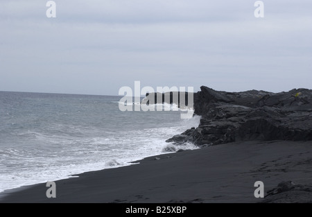 Black sand beaches of Hawaii’s Big Island. Composed of worn pieces ...