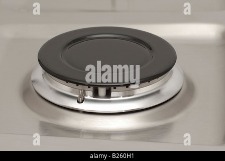 Gas burner with flame in the inox background Stock Photo - Alamy