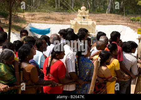 People queue to enter one of the temples containing the sacred Lingam ...