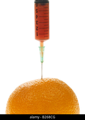 Orange injected with syringes Stock Photo - Alamy