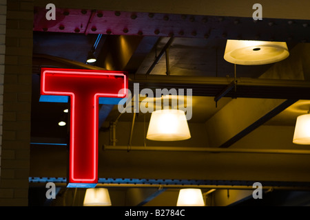 Indoors large red neon letter T Stock Photo - Alamy