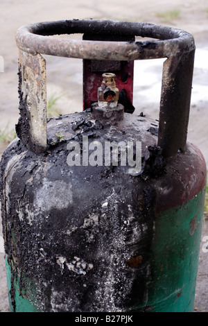 Damaged cooking gas cylinder caused by fire Stock Photo - Alamy