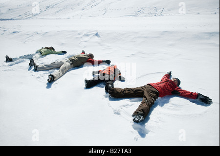 Boys making snow angels Stock Photo - Alamy