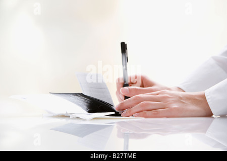 Woman Writing Check Stock Photo - Alamy
