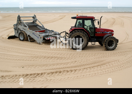 Seaside beach cleaning machine tractor pulled seen here in action in ...