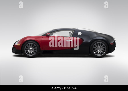 Black Bugatti Veyron in profile (side view) driving fast on a country ...