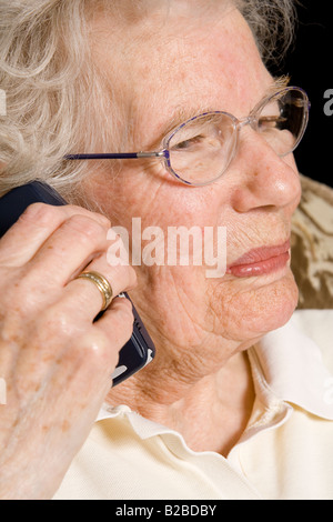 A senior woman gossiping on the phone Stock Photo - Alamy