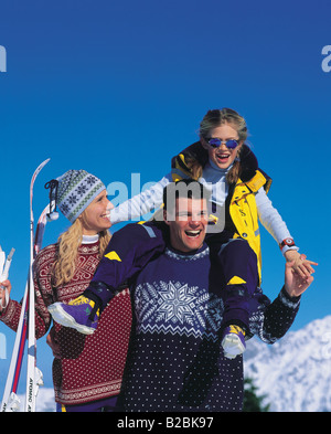 Family in the snow Stock Photo - Alamy
