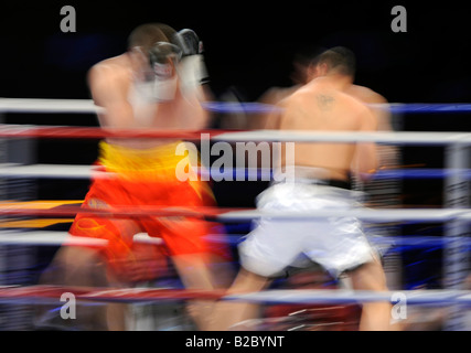 Boxing match with motion blurred boxers Stock Photo - Alamy