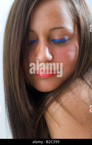 young heavily rouged woman with long brown hair and red lips Stock ...