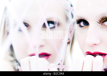 mirror image of a young, heavily rouged woman Stock Photo - Alamy