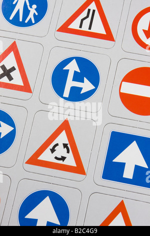 Various traffic signs printed on cardboard paper Stock Photo - Alamy