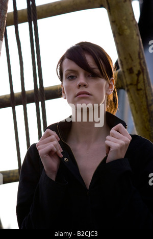 Young woman posing on blue background Stock Photo - Alamy