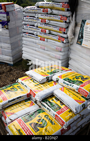 Bags of compost on sale in a London branch of B & Q Stock Photo - Alamy