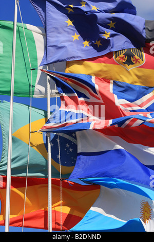 Flags of Argentina, Italy, Brazil and Germany hang over an alley, on ...