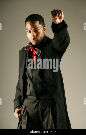 Strong young african man dressed in sportswear tying his shoelace at ...