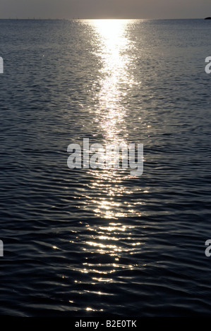 Moonlight path on night sea water surface Stock Photo - Alamy