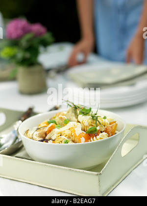 A vertical high-angle view of trays of colorful macarons displayed on a ...