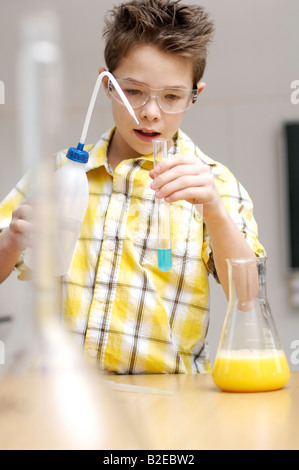 Boy doing experiments laboratory Stock Photo - Alamy