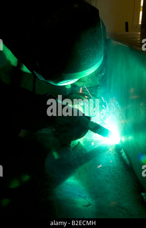 Worker Heliarc welding an aluminum truck chassis at Spartan Motors ...