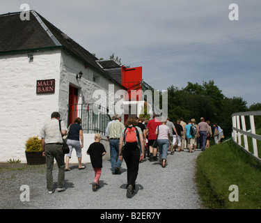 tourists on guided tour at Edradour distillery Scotland July 2008 Stock ...