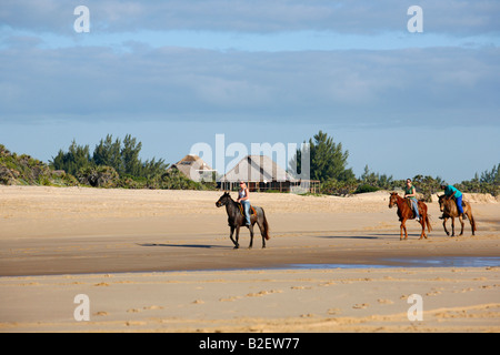 People horse riding on the beach near Søndervig on the west coast of ...