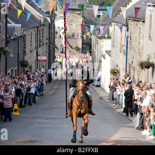 Traditional Scottish event Langholm Common Riding cornet charging on ...