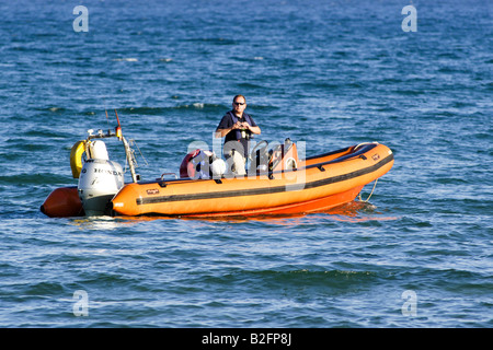 An RNLI small inflatable RIB inshore lifeboat used for local water ...