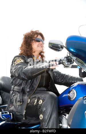A woman riding Harley Davidson motorcycle Stock Photo - Alamy