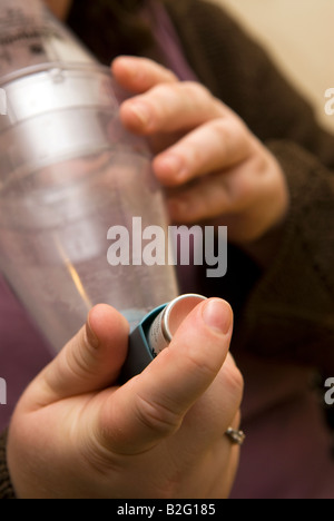 Ventolin asthma inhaler use by 7 year old Caucasian girl Stock Photo ...