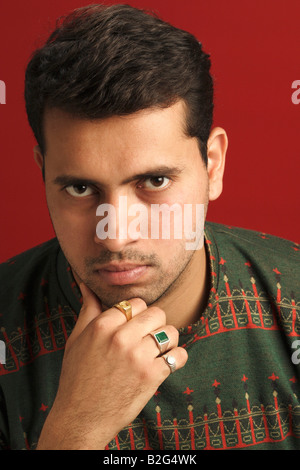 portrait of man serious expression red background Stock Photo - Alamy
