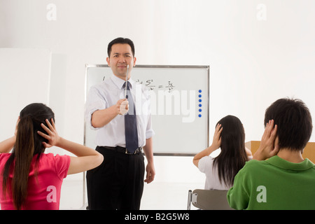 Male professor scolding students Stock Photo - Alamy