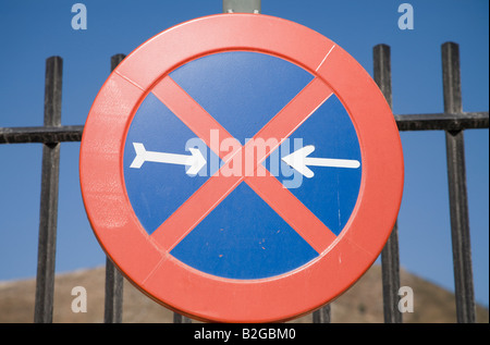 Traffic sign meaning no parking in either direction or car will be ...