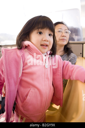 Child standing on train seat traveling inside high speed train. closeup ...