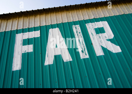 Green metal wall with FAIR written on it Stock Photo - Alamy
