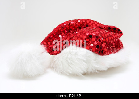 A red santas hat shot on white Stock Photo - Alamy