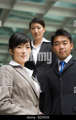 Three businessmen standing together Stock Photo - Alamy