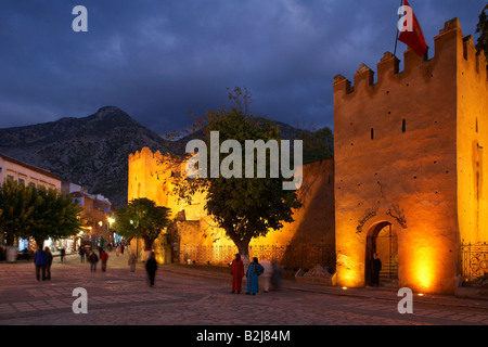Plaza Uta el-Hammam and the Fondouk at dusk, Chefchaouen, Morocco Stock ...
