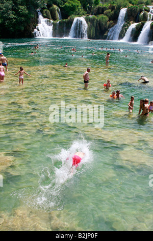 Croatian holidaymakers enjoying swimming in the spectacular waterfalls ...
