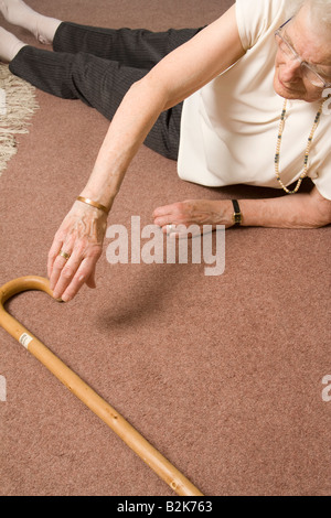 Old woman is fallen at the floor Stock Photo - Alamy